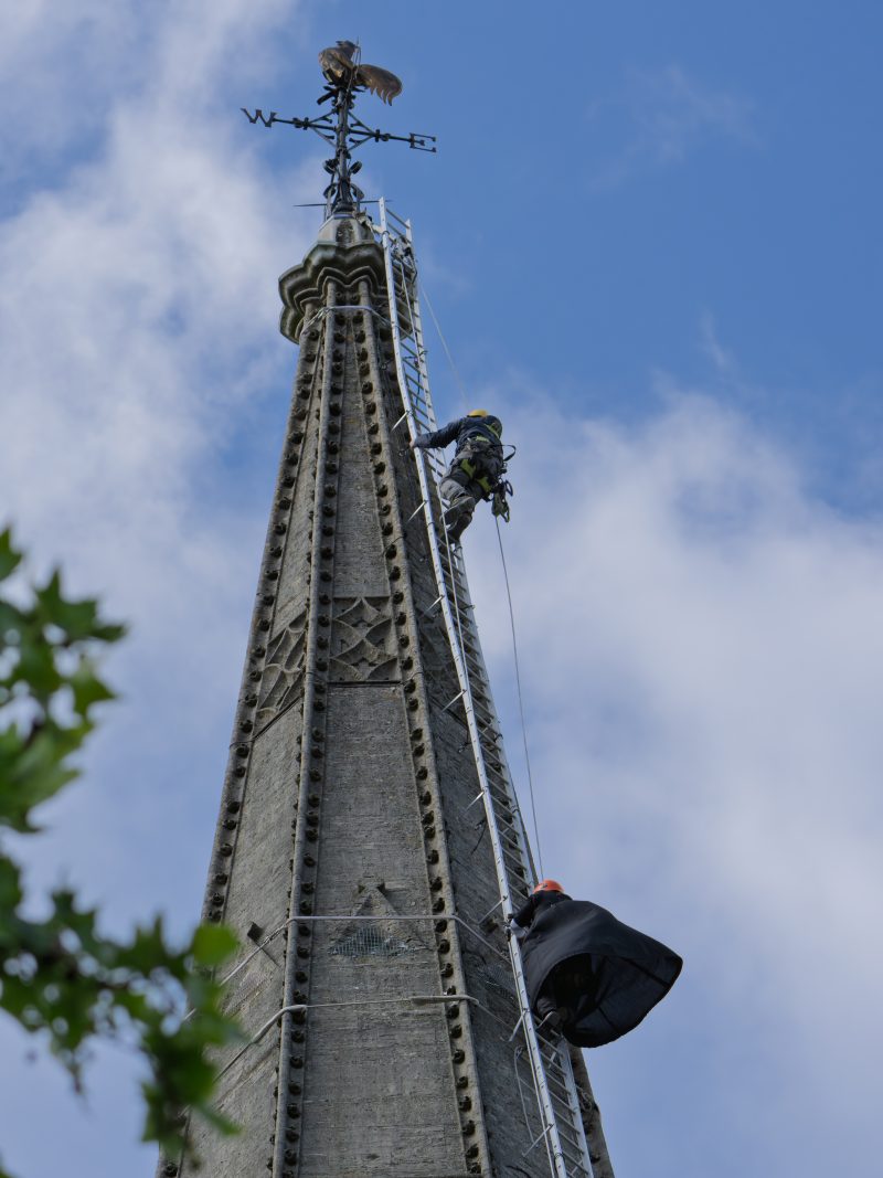 Vicar scales historic church spire to support solar panel project